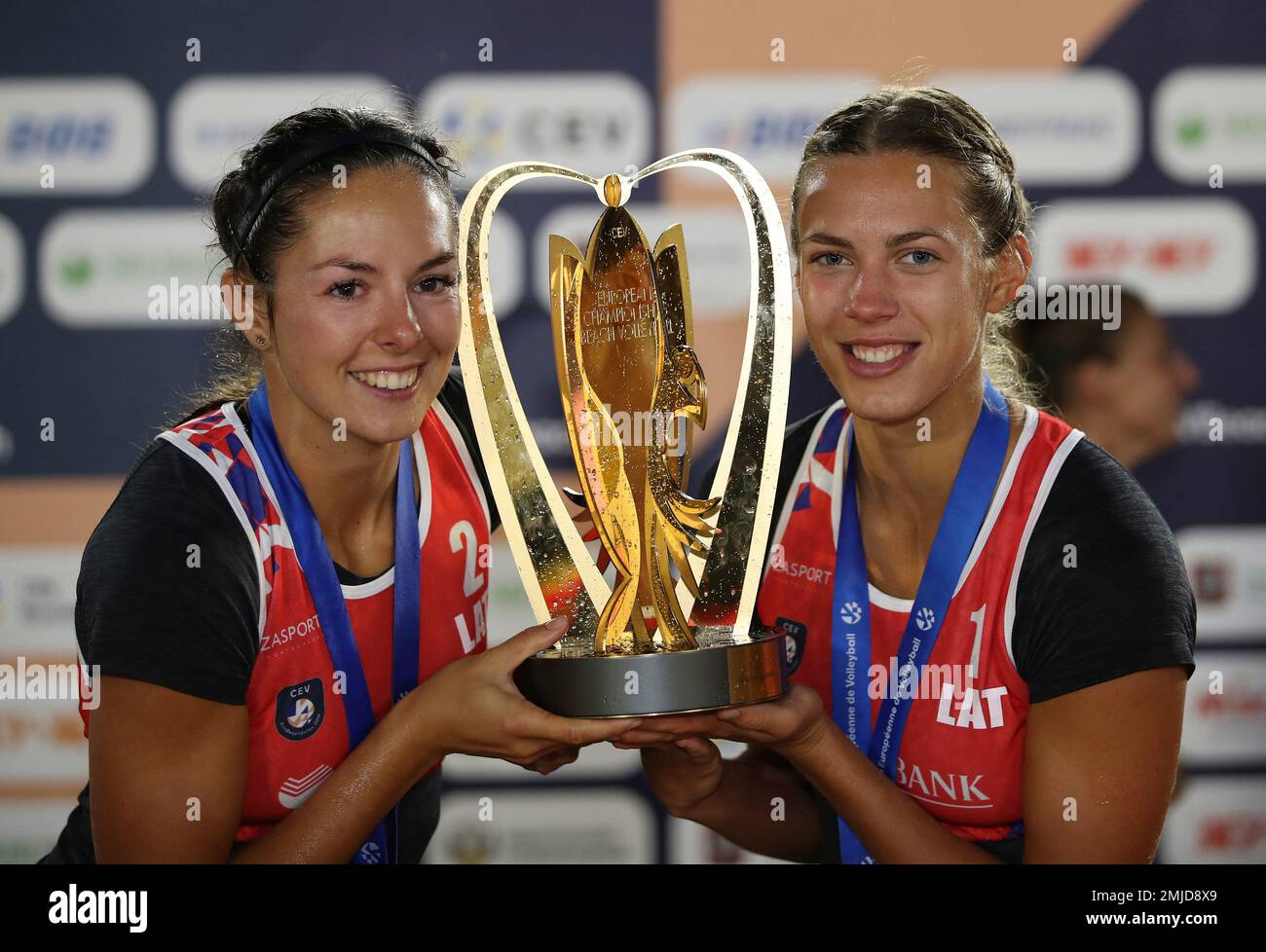 Latvia's Tina Graudina, right, and Anastasija Kravcenok pose with their ...