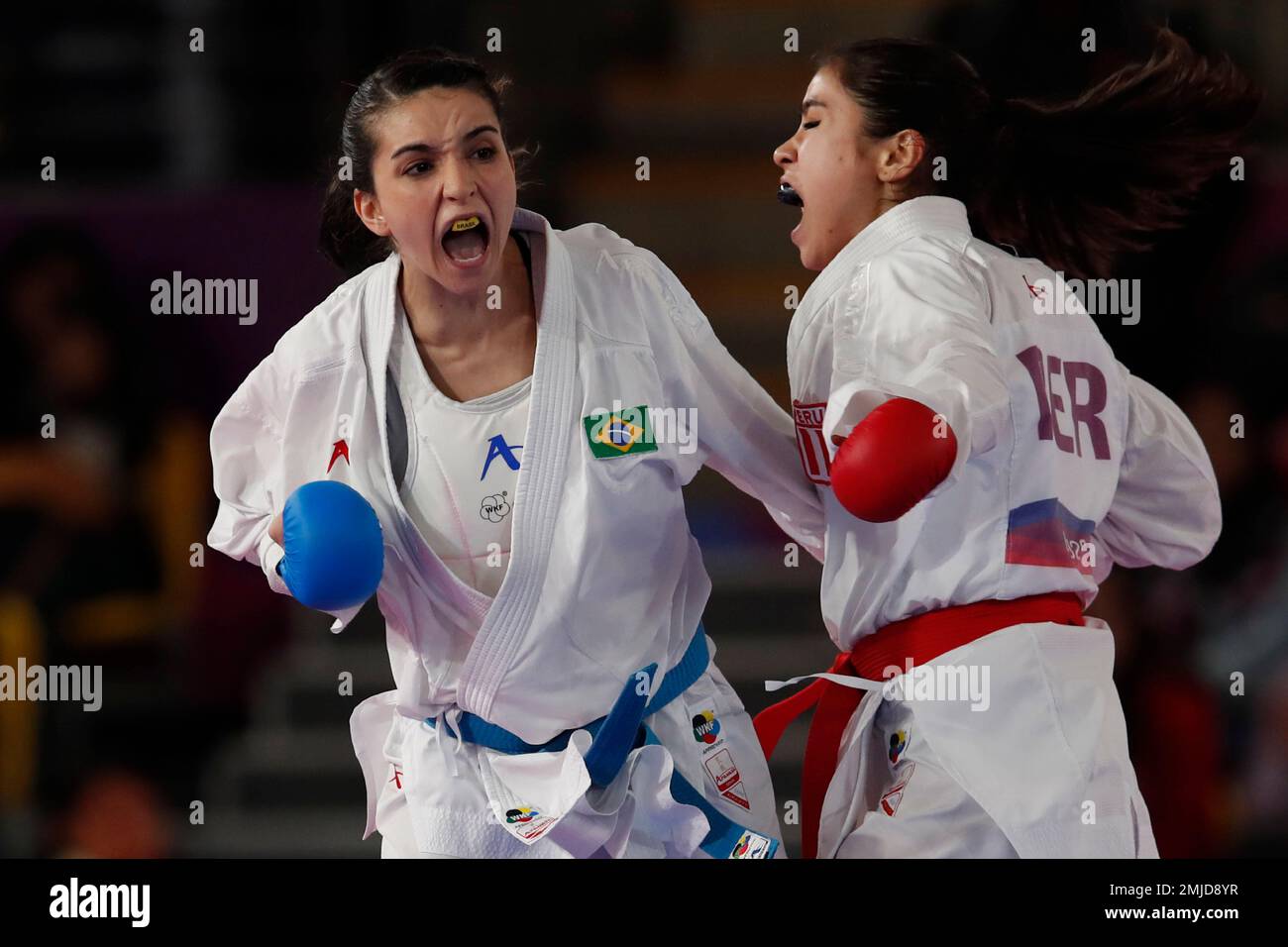 Selene Rodriguez of Peru, right, competes against Jessica De Paula of ...