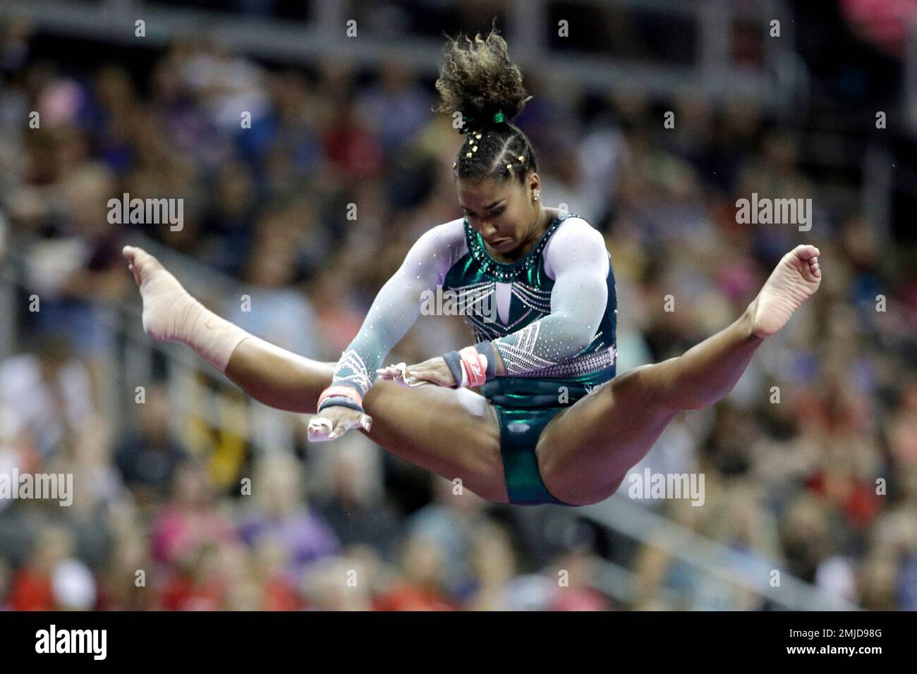 Jordan Chiles competes on the uneven bars during the senior women's ...