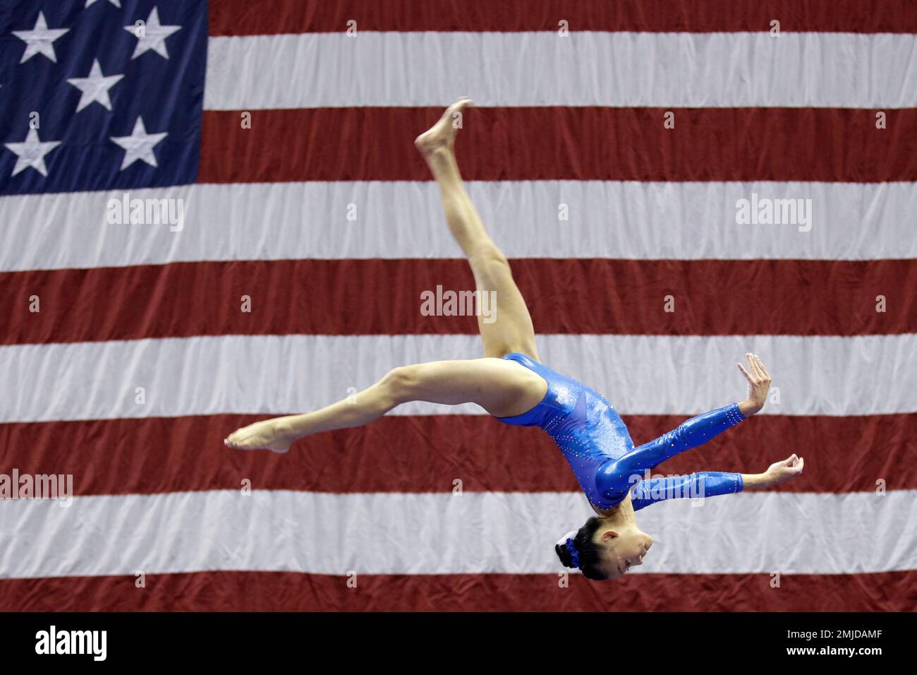 Leanne Wong competes on the beam during the senior women's competition ...