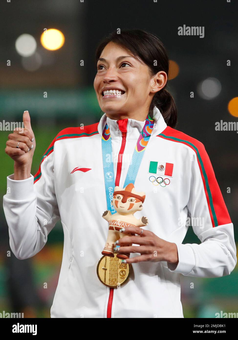 Laura Galvan ofMexico celebrates with her gold medal at the podium for ...