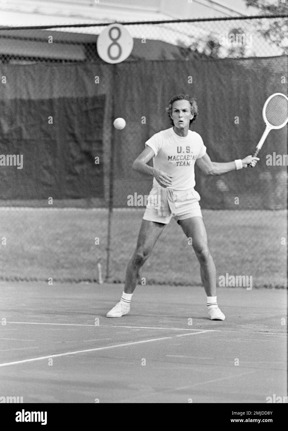 Dr. Richard Raskind prepares to return the ball during a tennis match ...