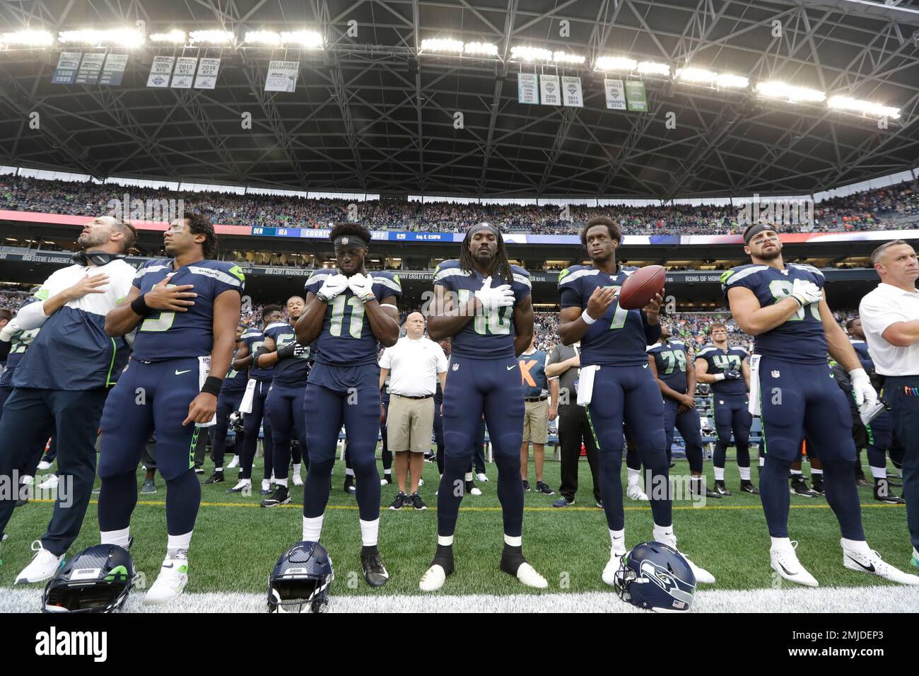 Seattle Seahawks players, including quarterback Russell Wilson (3 ...