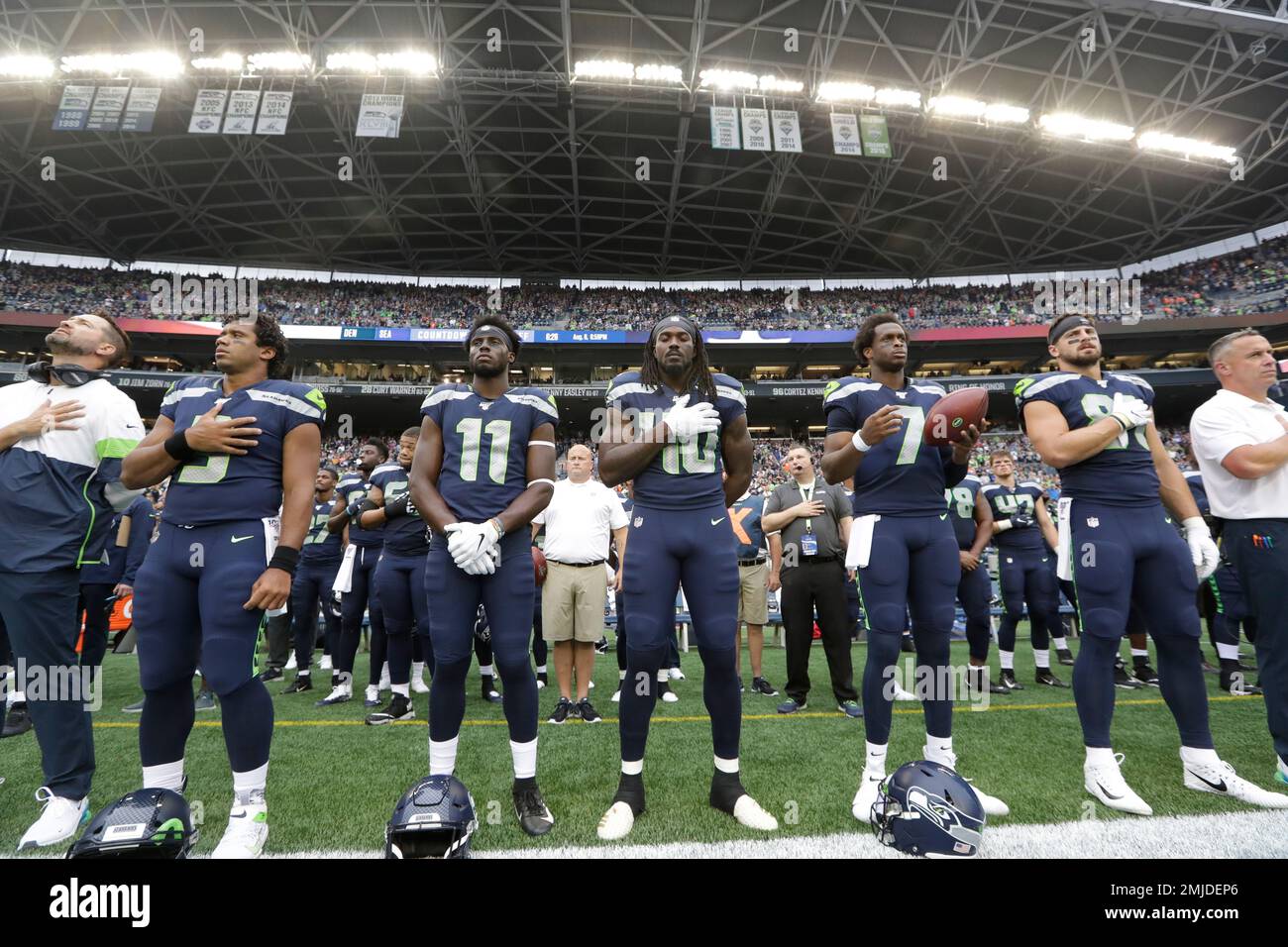 Seattle Seahawks players, including quarterback Russell Wilson (3 ...