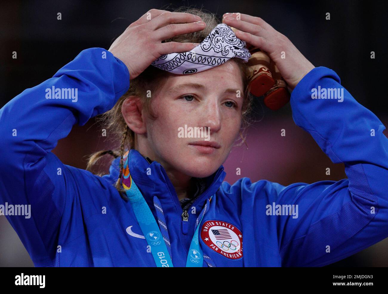 Whitney Conder of the U.S. replaces her bandana after taking it off for ...