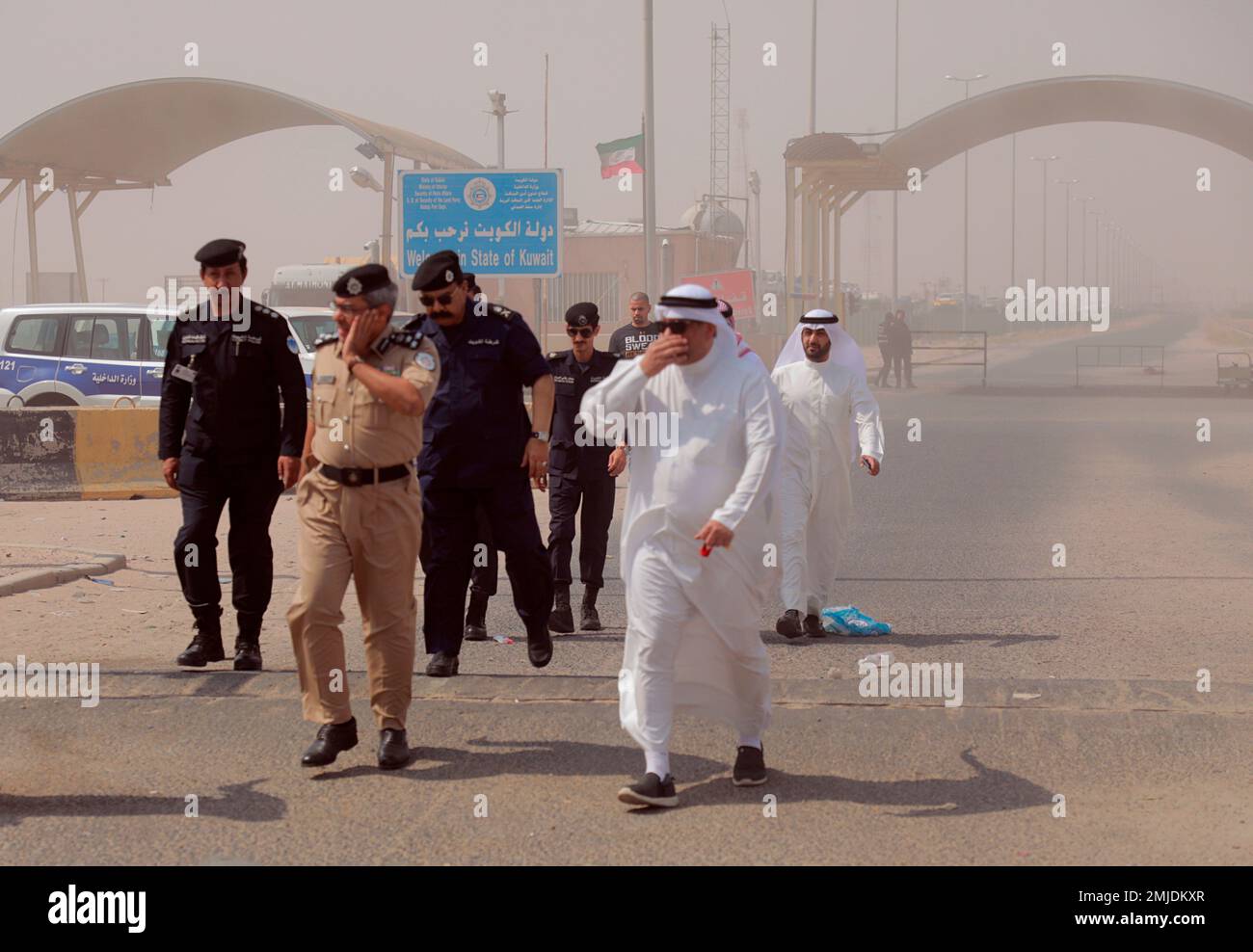 Kuwaiti officials arrive for a handover ceremony for the remains of 48 ...