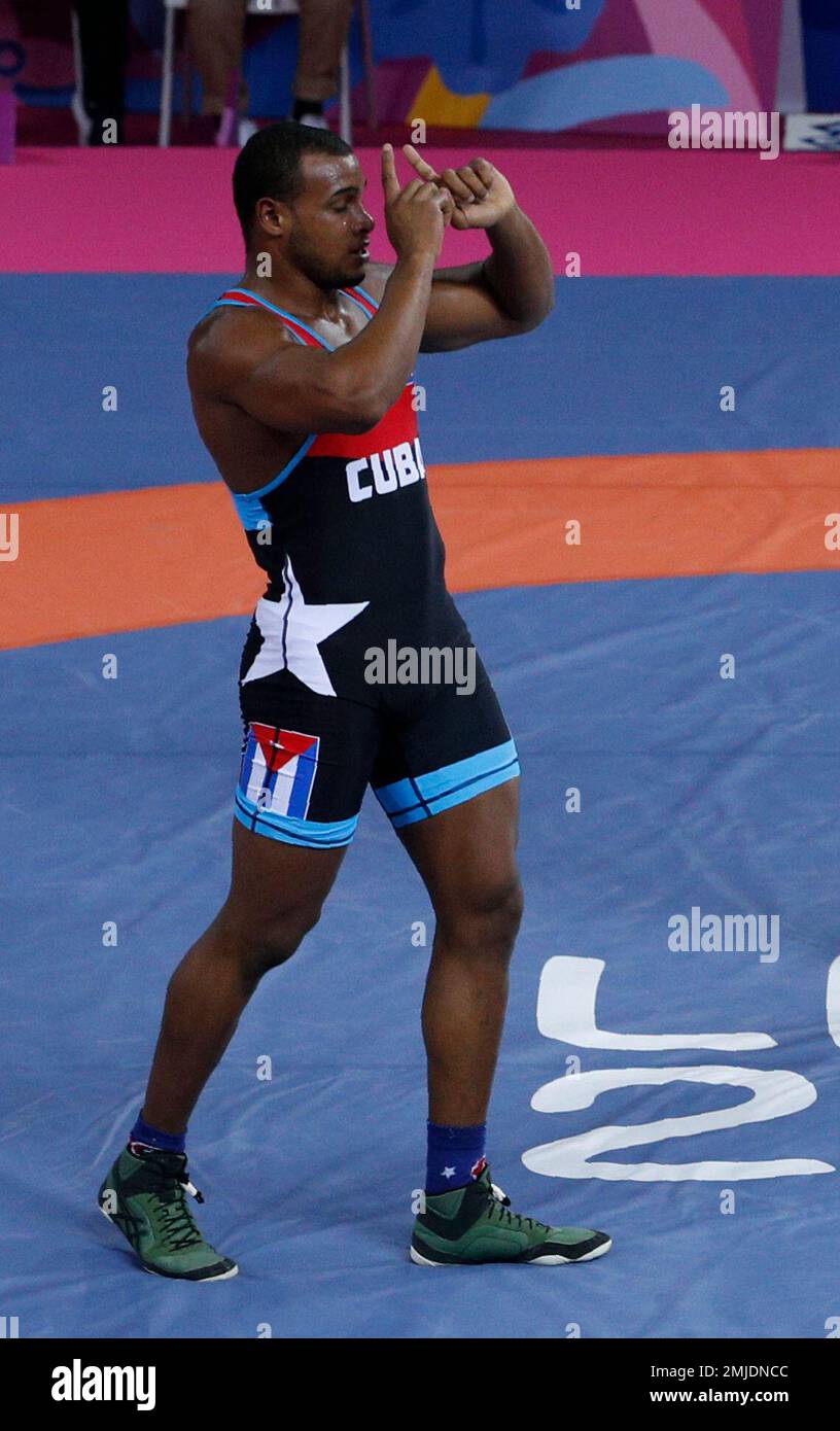 Cuba's Gabriel Rosillo celebrates after defeating Tracy Hancock of the ...
