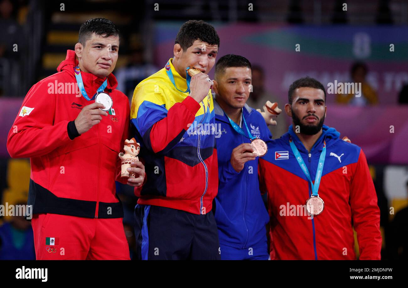 From left, silver medalist Alfonso Leyva of Mexico, gold medalist Luis ...
