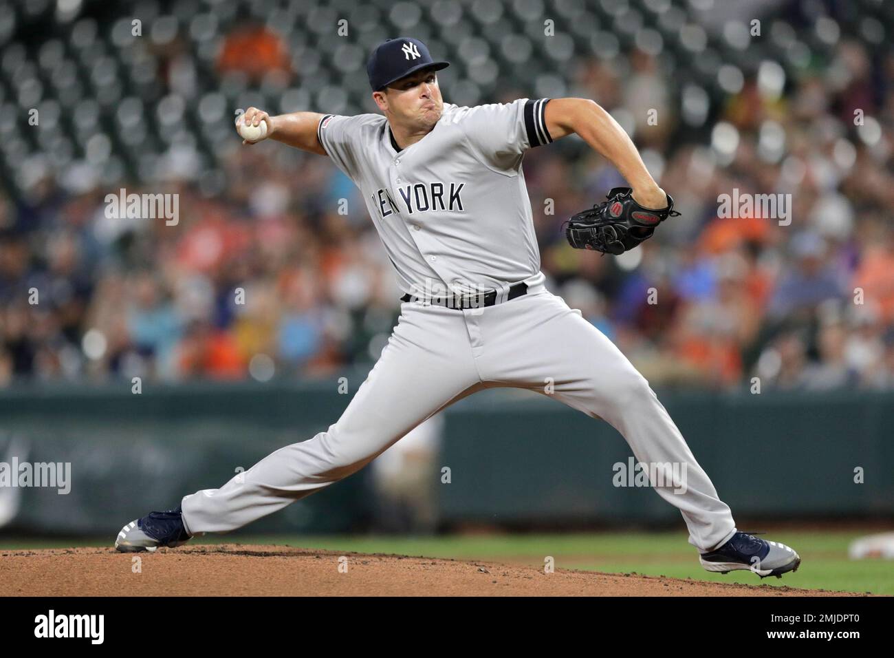 New York Yankees starting pitcher Jonathan Holder throws a pitch to a ...