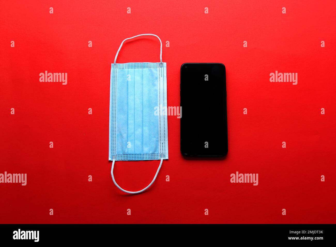 New normal, cell phone and protection mask clinical use Stock Photo - Alamy