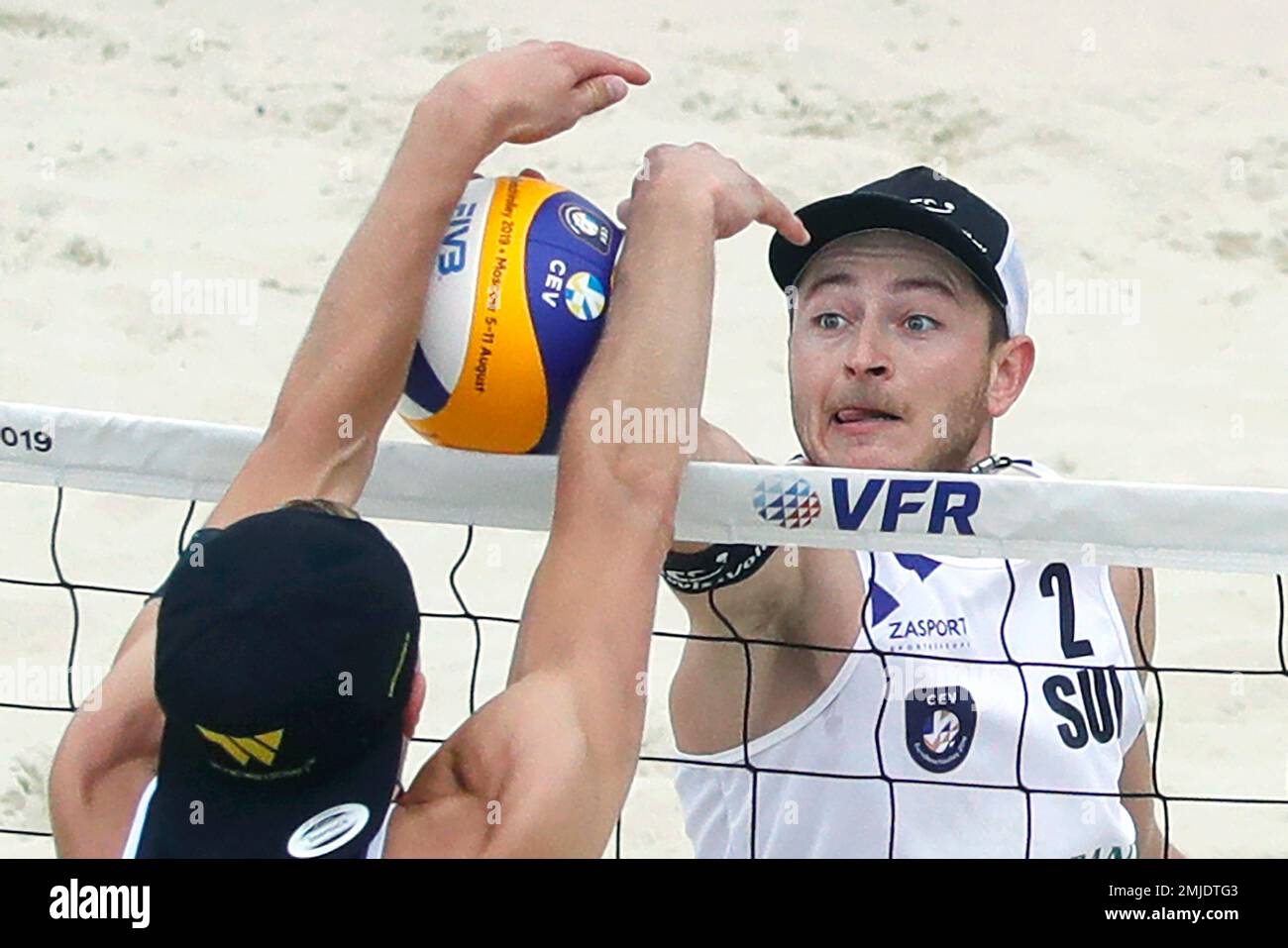 Switzerland's Mirco Gerson, right, plays the ball as Germany's Philipp ...