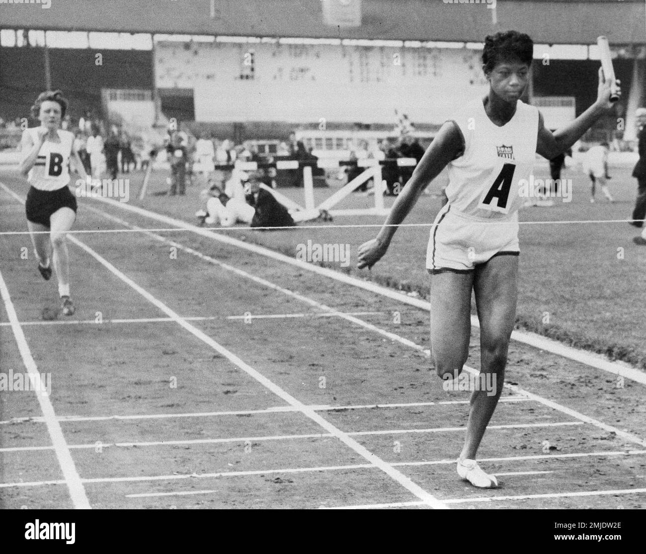 Wilma Rudolph of the U.S. strides well away from Betty Moore at the ...