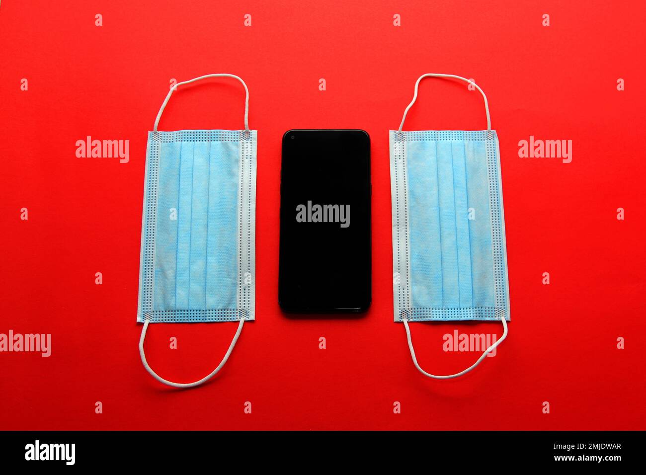 New normal, cell phone and protection mask clinical use Stock Photo - Alamy