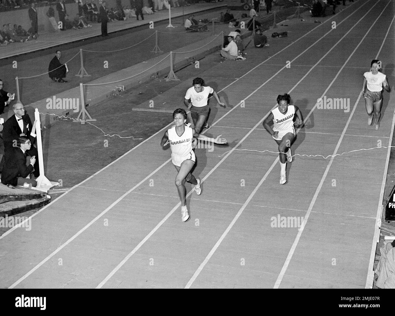 Wilma Rudolph, left foreground, Tennessee State University, breaks tape ...