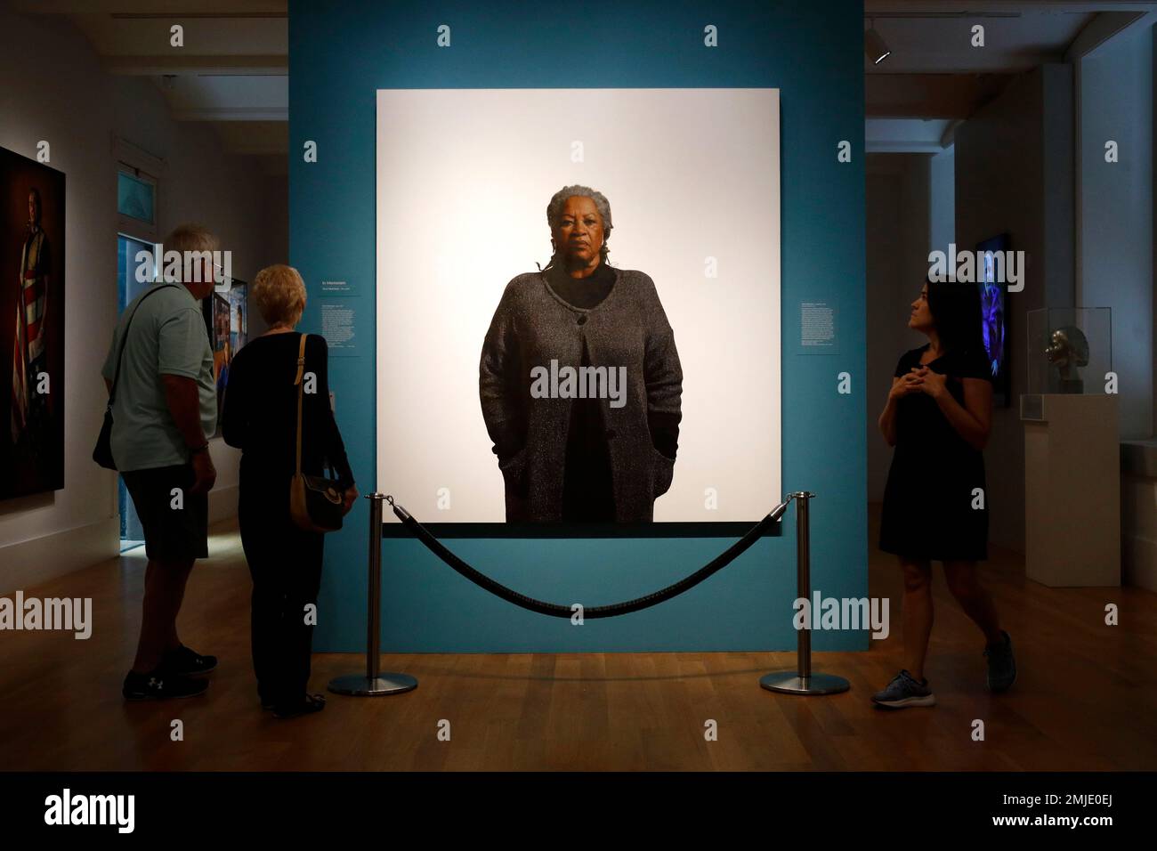 Visitors view a portrait of Nobel laureate Toni Morrison, painted by the artist Robert McCurdy ...
