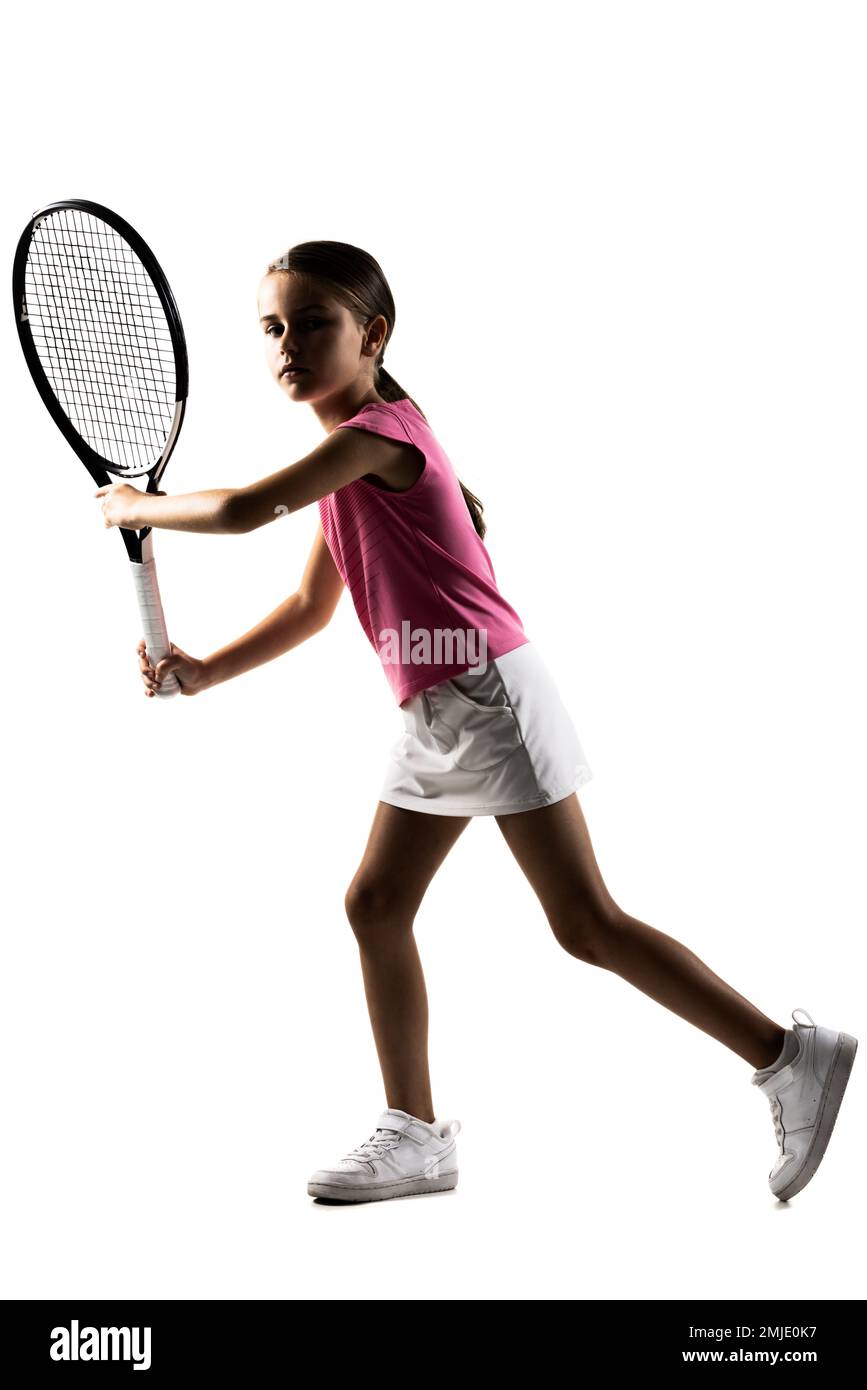 Young female tennis player in pink outfit. Little girl posing with ...