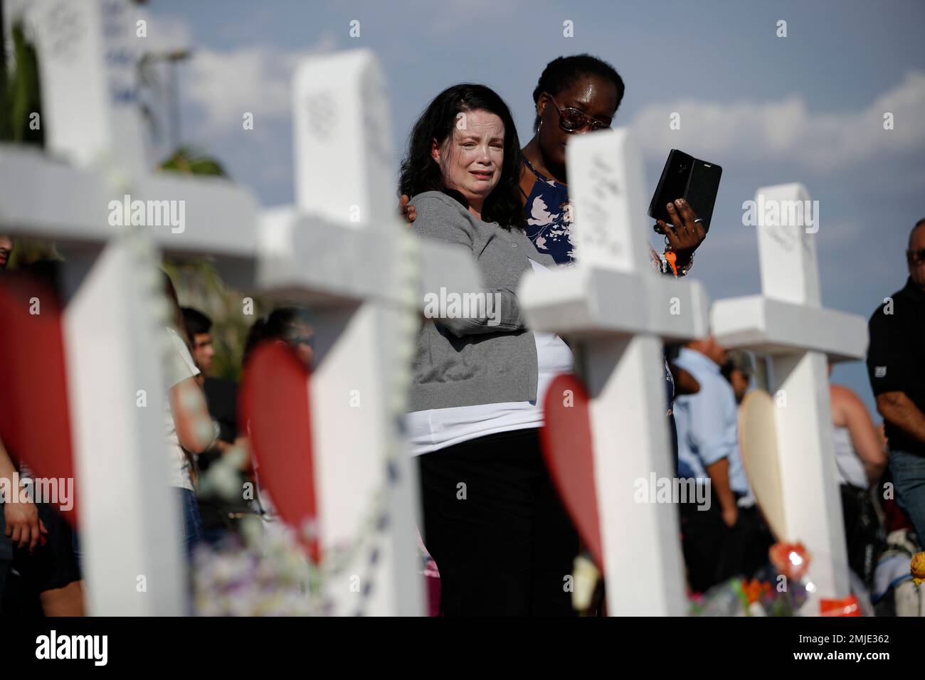 Christina Pipkin cries as she visits a makeshift memorial, Monday, Aug ...