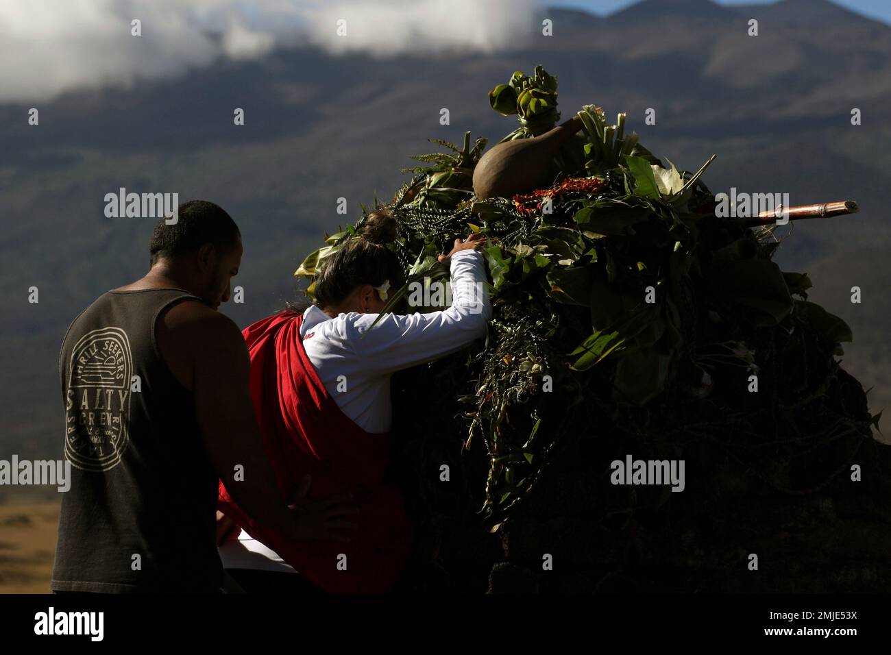 FILE - In this July 14, 2019 file photo, native Hawaiian activists pray ...