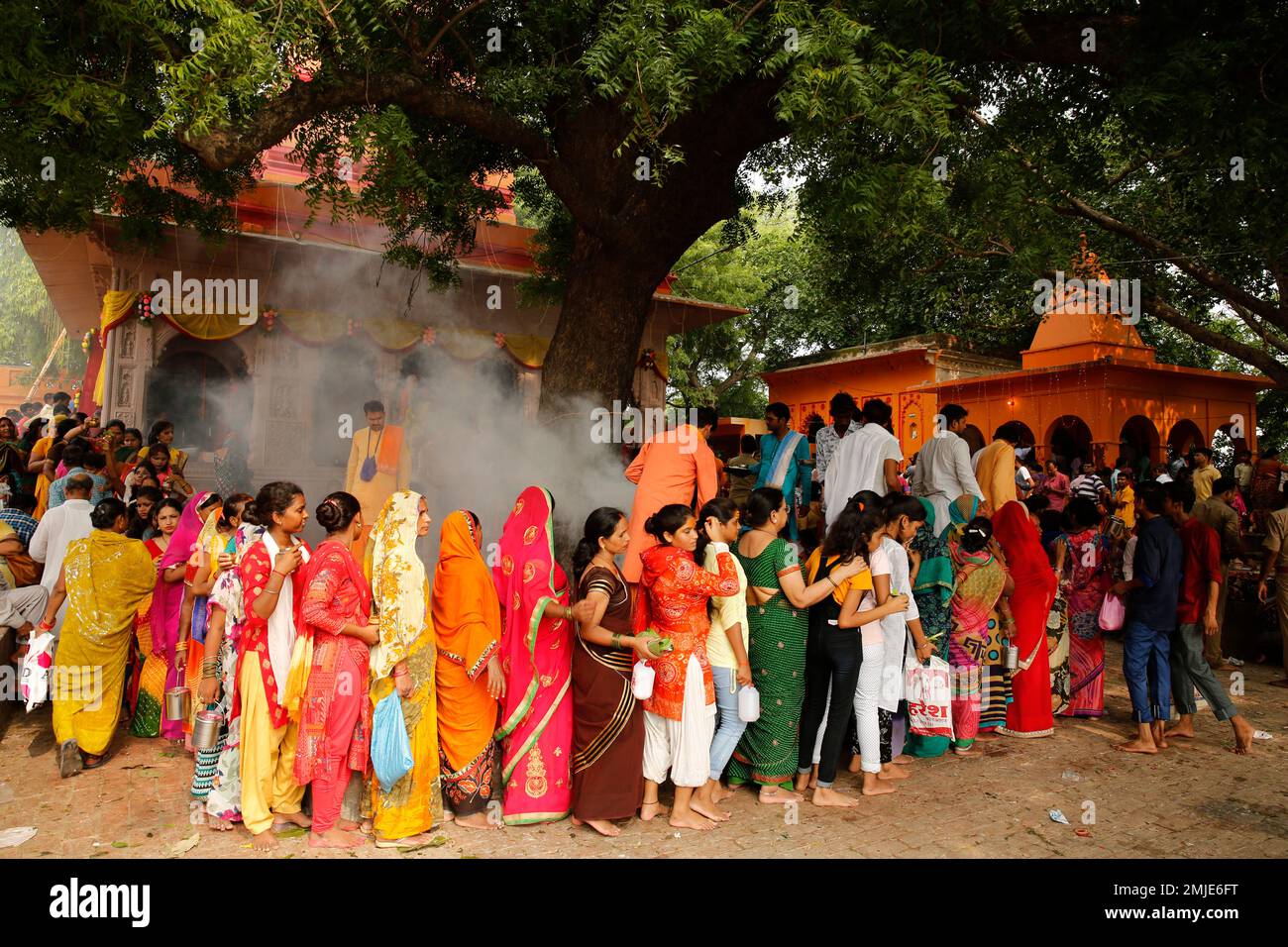 Indian Hindu devotees queue up to offer prayers at the Nag Vasuki ...