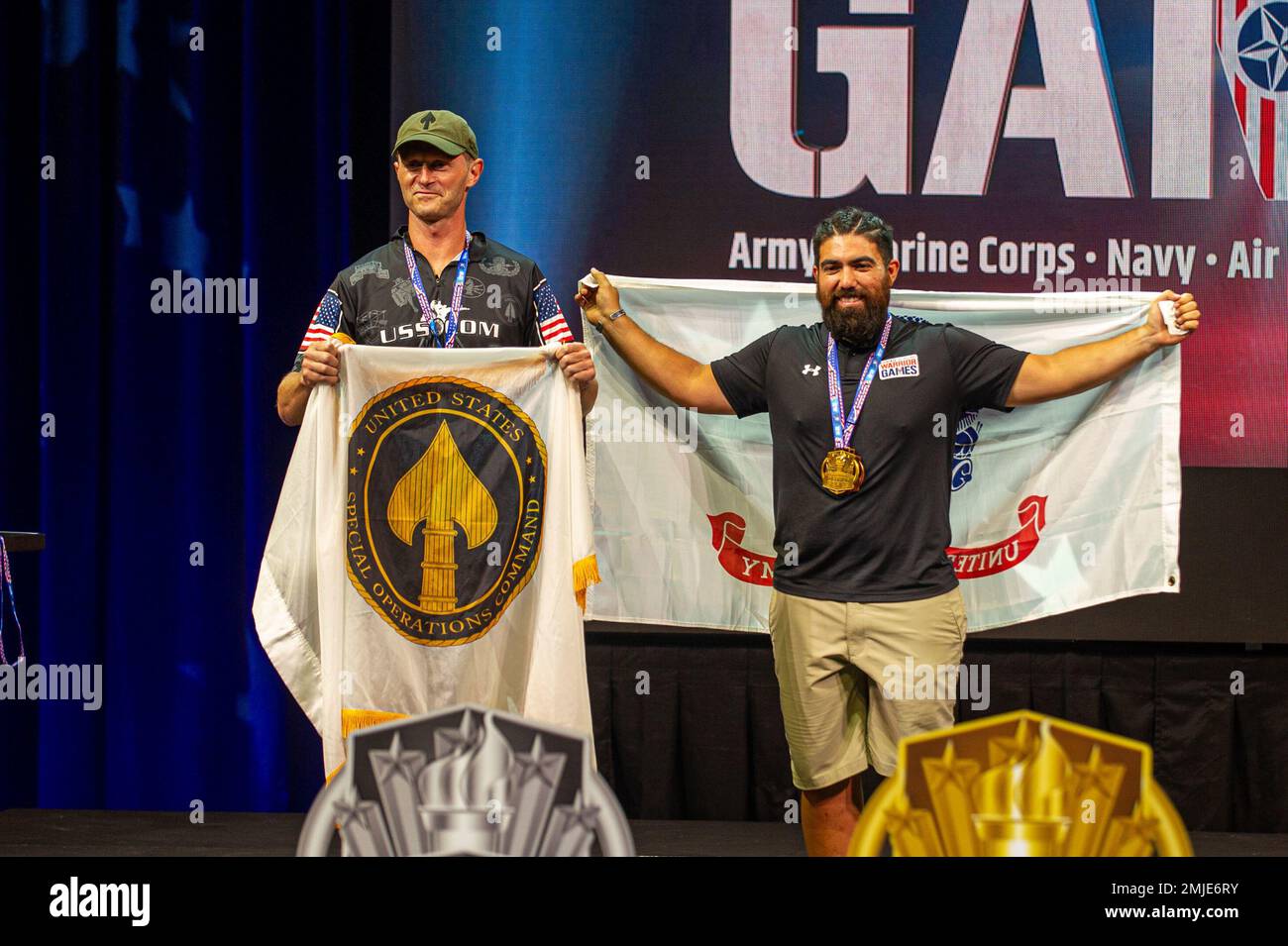 Retired U.S. Army Sgt. Justin Mathers, right, poses for a photo along ...
