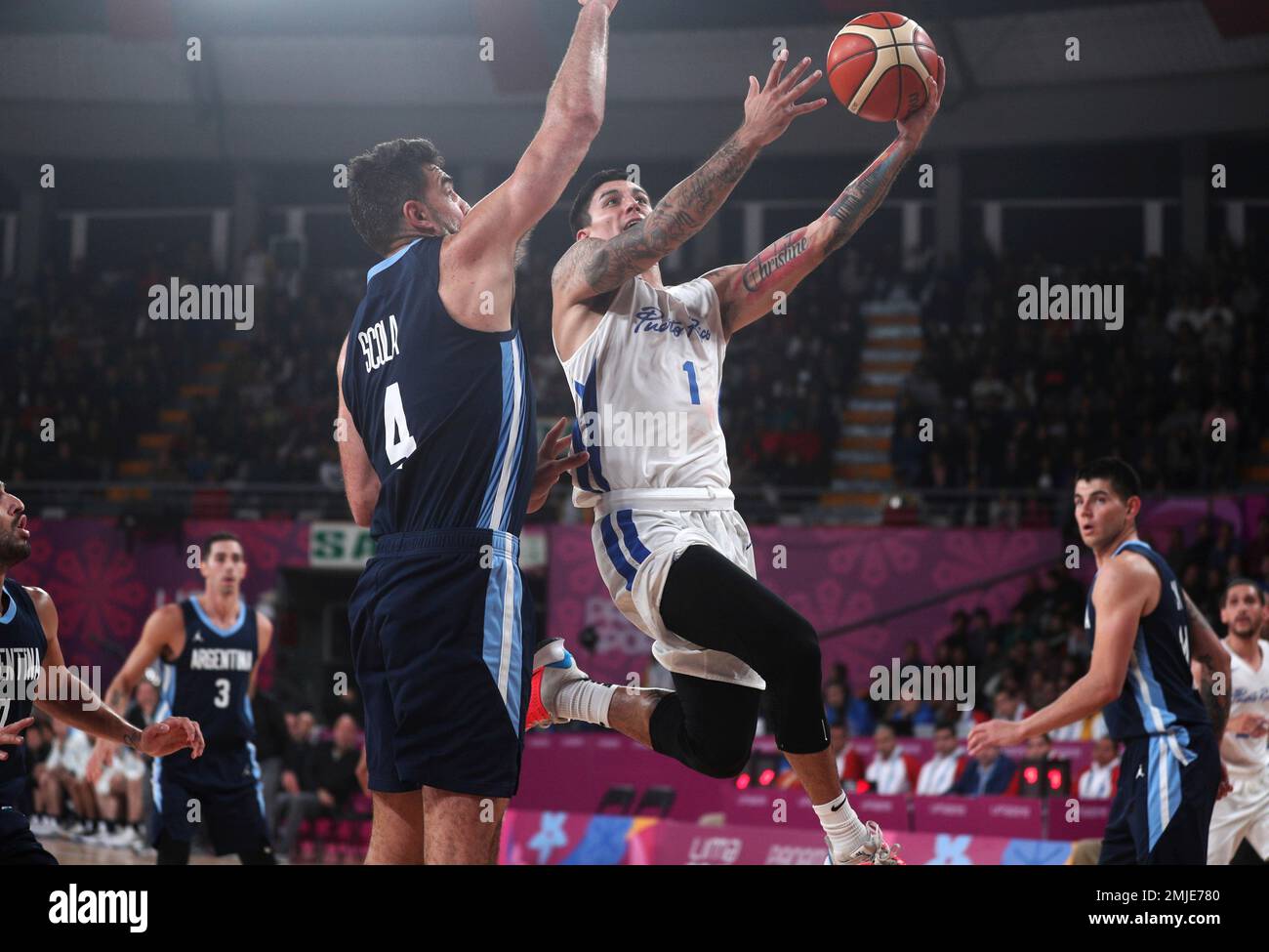 Joseph Soto of Puerto Rico, right, shoots over Luis Scola of Argentina ...