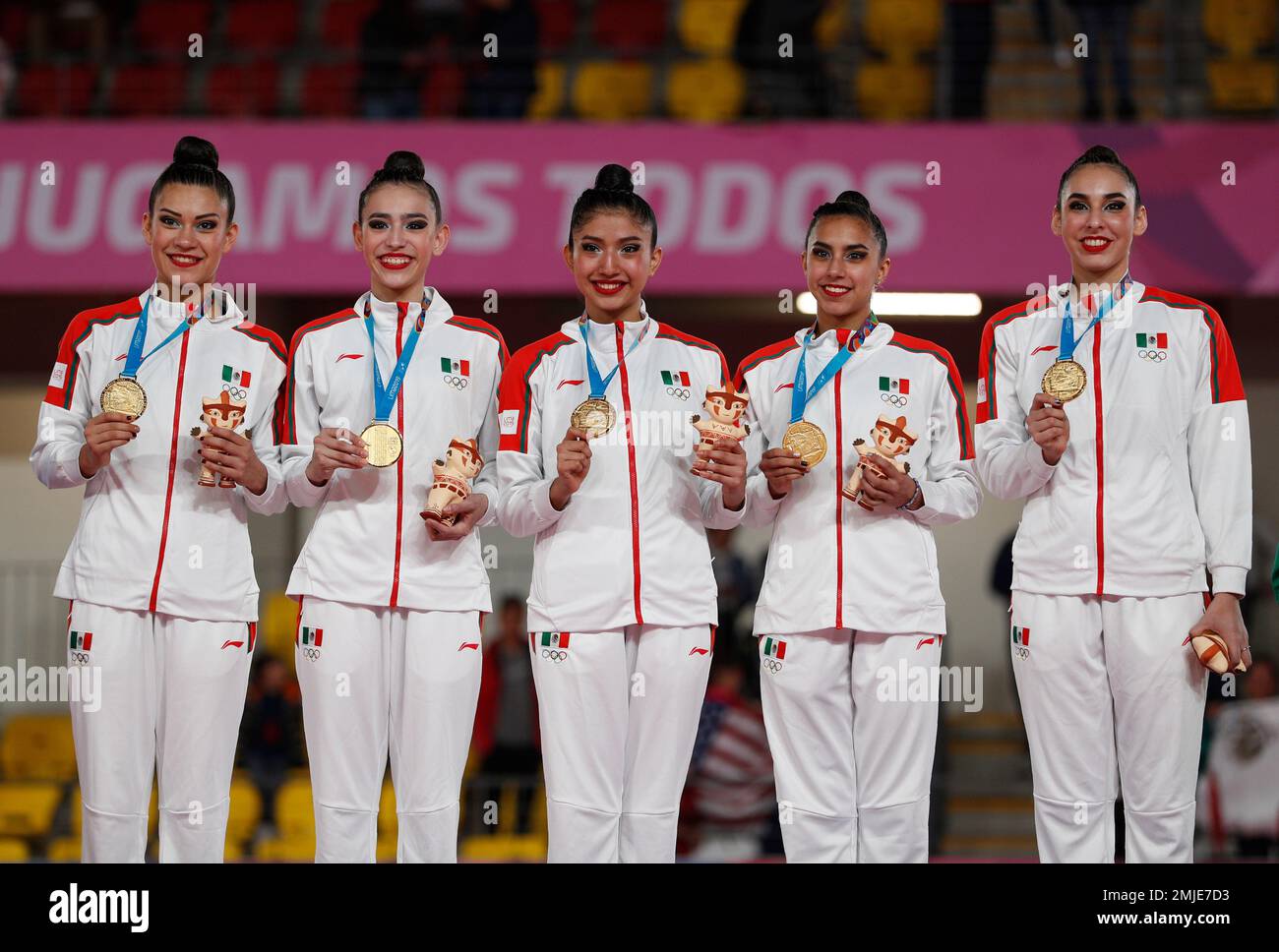 Mexico's rhythmic gymnastics team holds up their gold medals for the ...