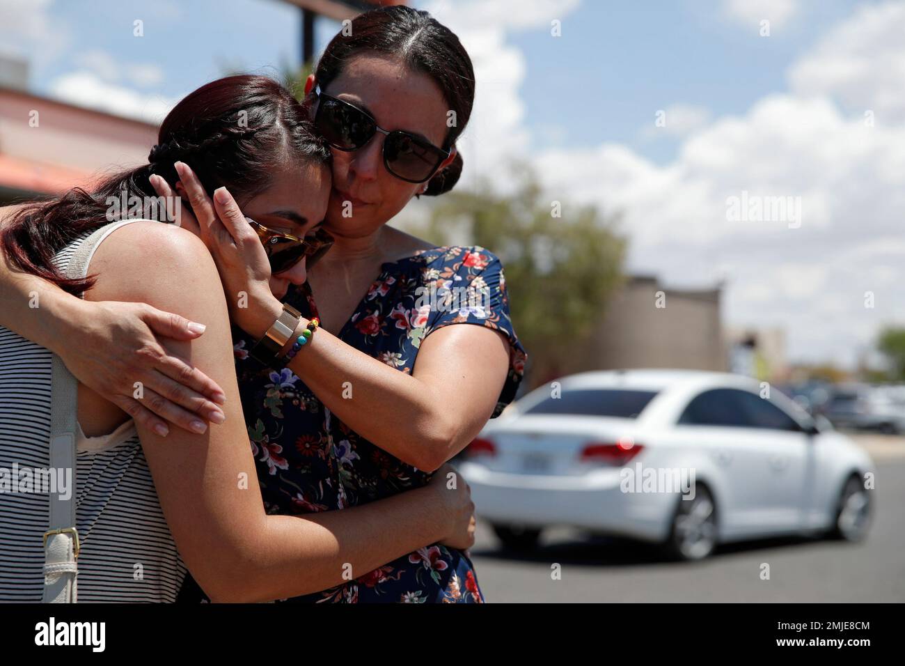 Cynthia Chavez, right, embraces her daughter Mia Chavez as they visit a ...