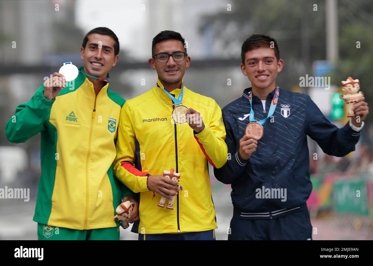 Gold medalist Brian Pintado of Ecuador, center, silver medalist Brazil ...