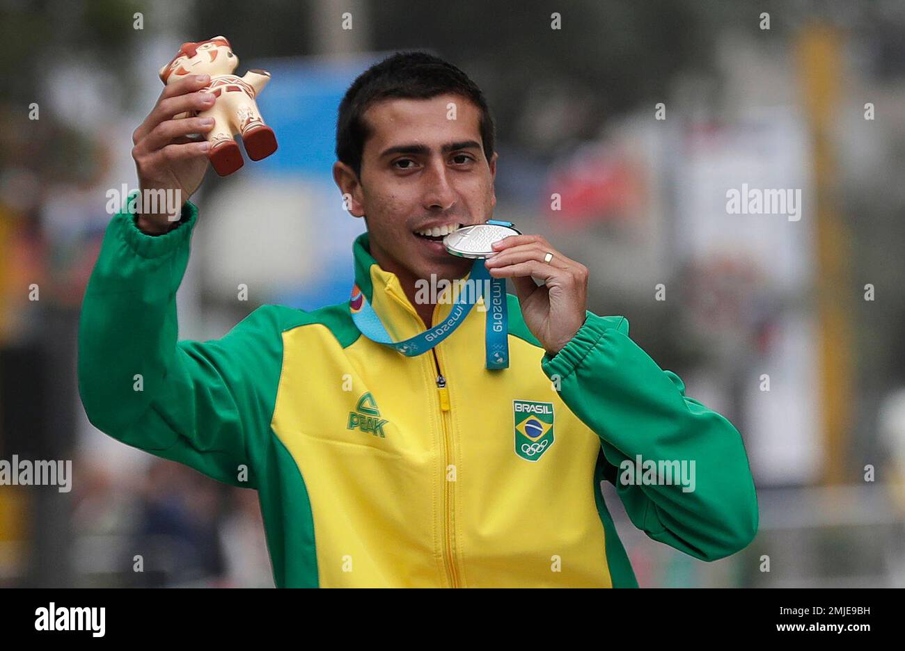 Brazil's Caio Oliveira poses for photos with his silver medal for the ...