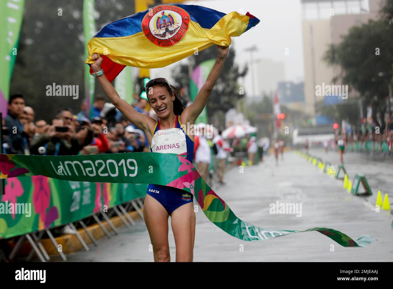 Sandra Arenas of Colombia crosses the finish line to win the gold medal ...