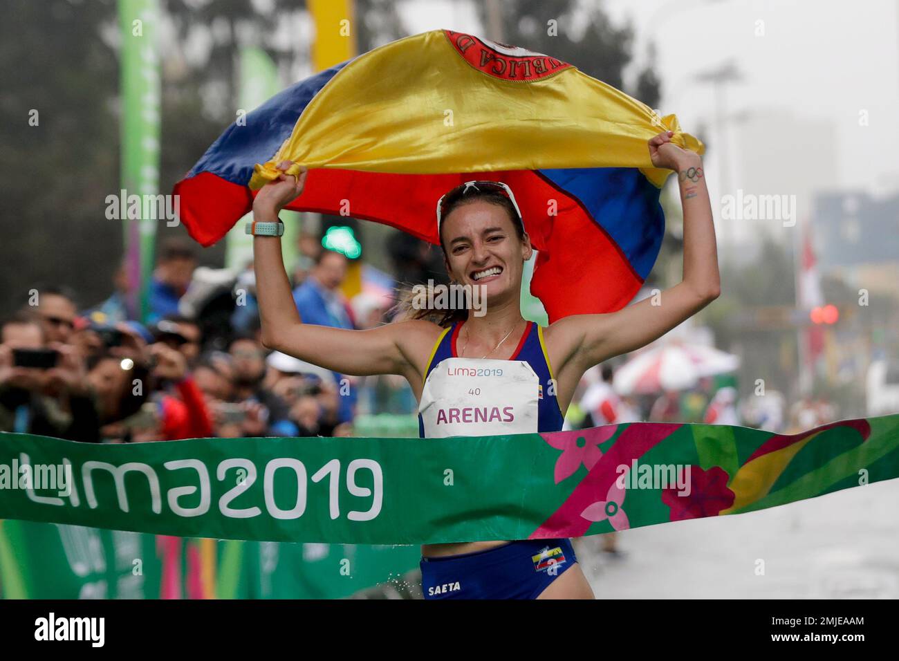 Sandra Arenas of Colombia crosses the finish line to win the gold medal ...