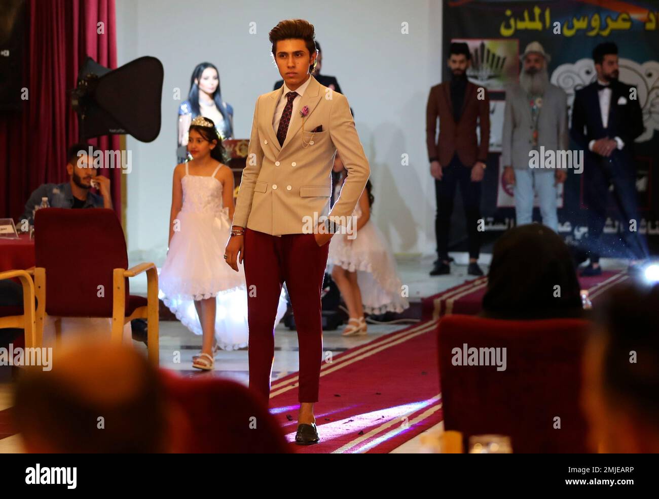 In this Saturday, Aug. 3, 2019, photo, a model wears a creation by ...