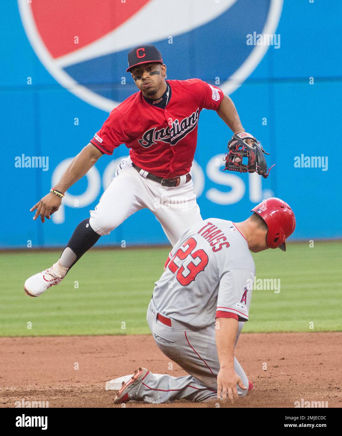 Cleveland Indians' Francisco Lindor avoids a sliding Los Angeles Angels ...