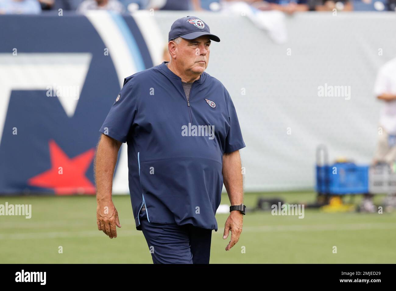 Tennessee Titans defensive coordinator Dean Pees walks on the field ...