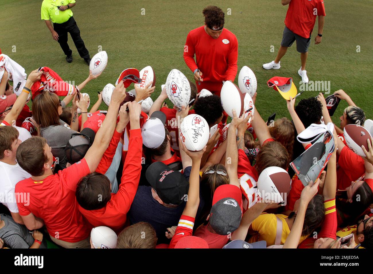 Kansas City Chiefs quarterback Patrick Mahomes signs autographs during ...