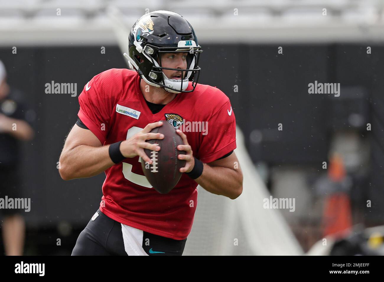 Jacksonville Jaguars quarterback Tanner Lee looks for a receiver during ...