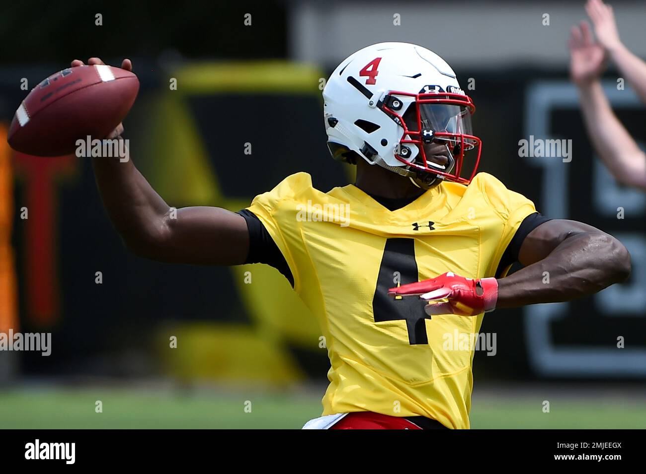 Maryland quarterback Lance Legendre (4) works out during an NCAA ...