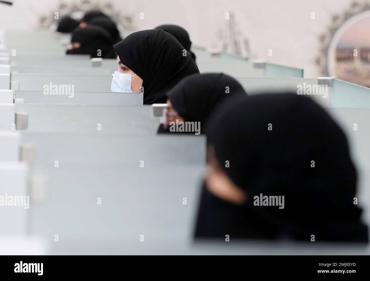 Saudi female officers from the national security forces, wait for ...
