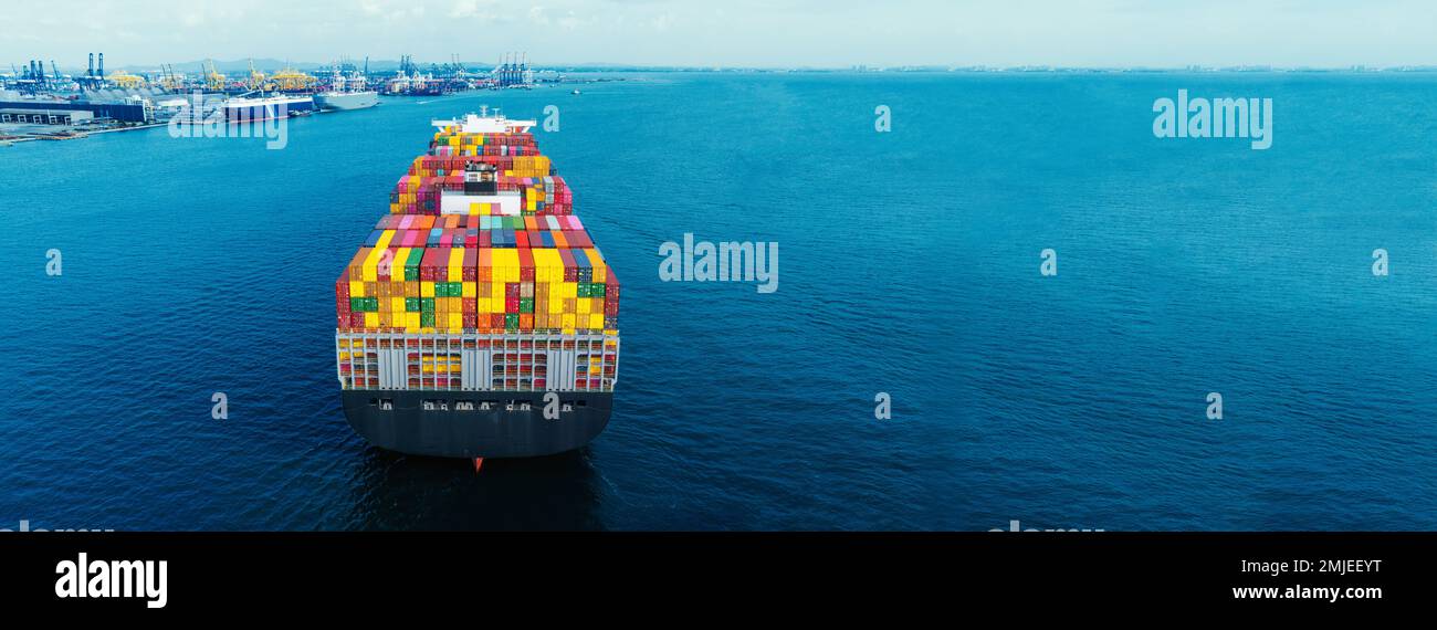 Stern of cargo ship carrying container and running for import goods ...