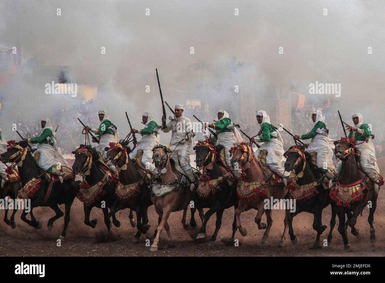 In this Thursday, July 25, 2019 photo, a troupe charges firing their ...