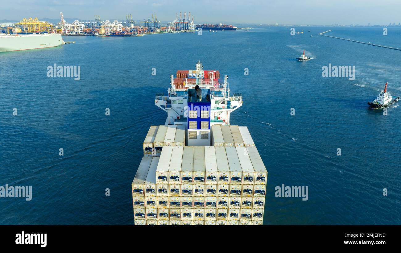 Stern of cargo ship carrying container and running for import goods ...
