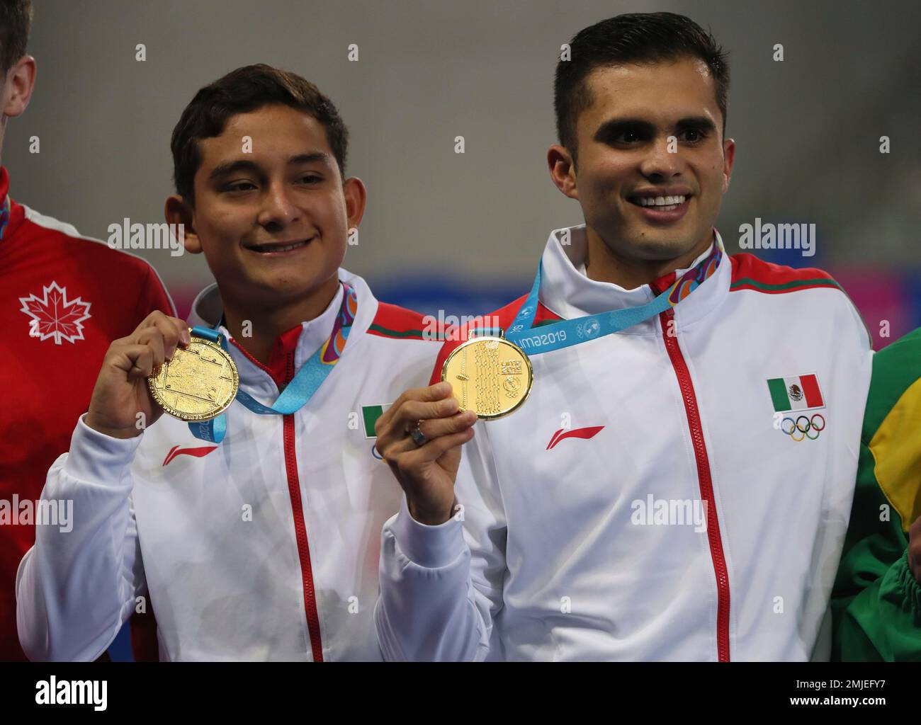 Mexico's Kevin Berlin, left, and Ivan Garcia pose with their gold ...