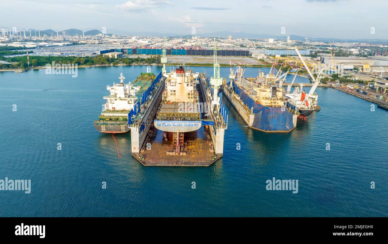 cargo container ship at dry dock concept maintenance service working in ...