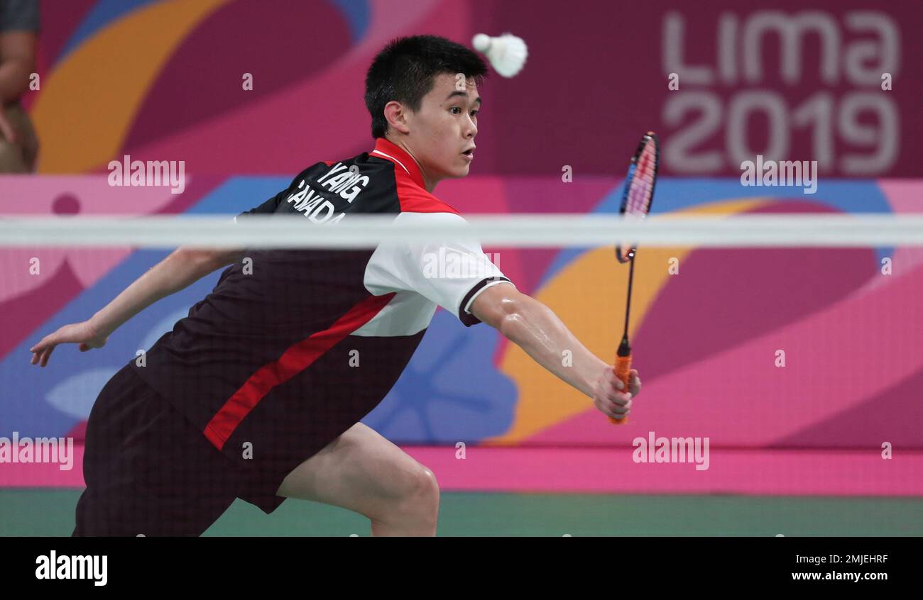 Brian Yang of Canada returns the shot to Ygor Coelho of Brazil during ...