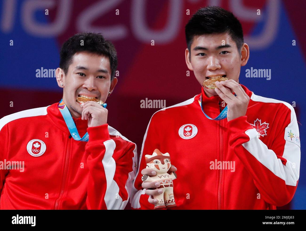 Gold medalist Jason Ho-Shue,right, and Nyl Yakura of Canada pose on the ...
