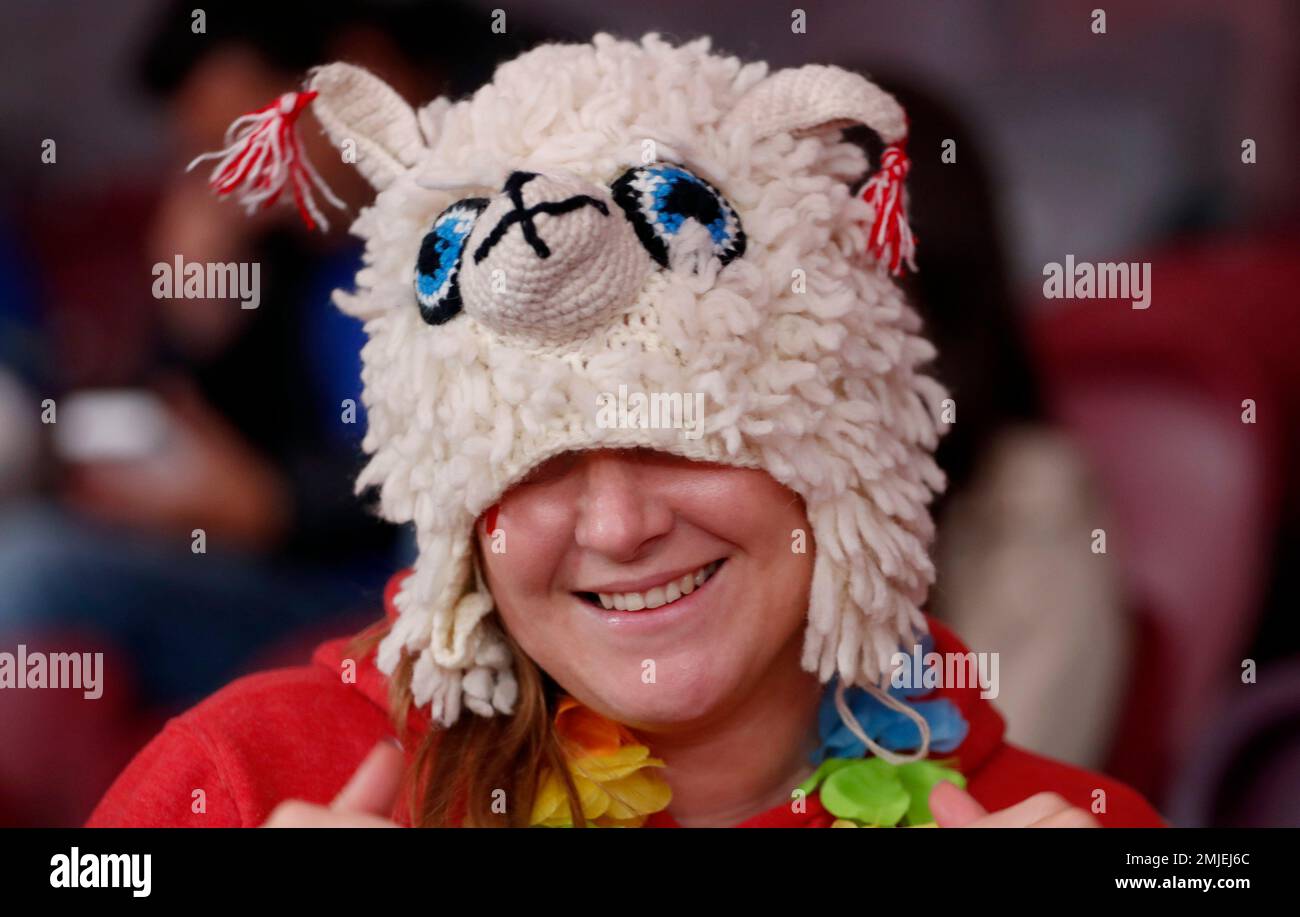 A fan of Canada cheers for Ho-Shue and Nyl Yakura during the badminton ...