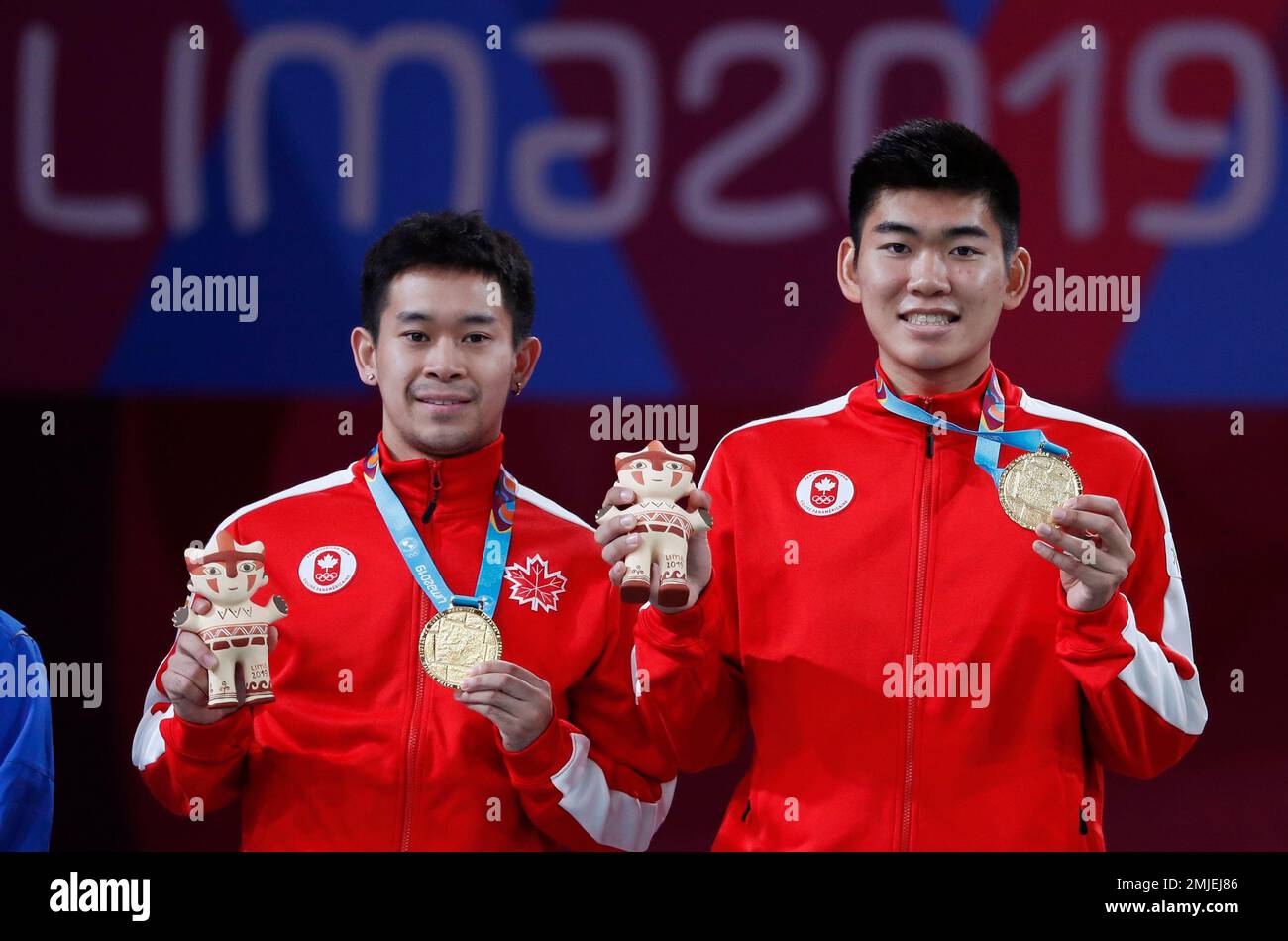 Gold medalist Jason Ho-Shue,right, and Nyl Yakura of Canada pose on the ...