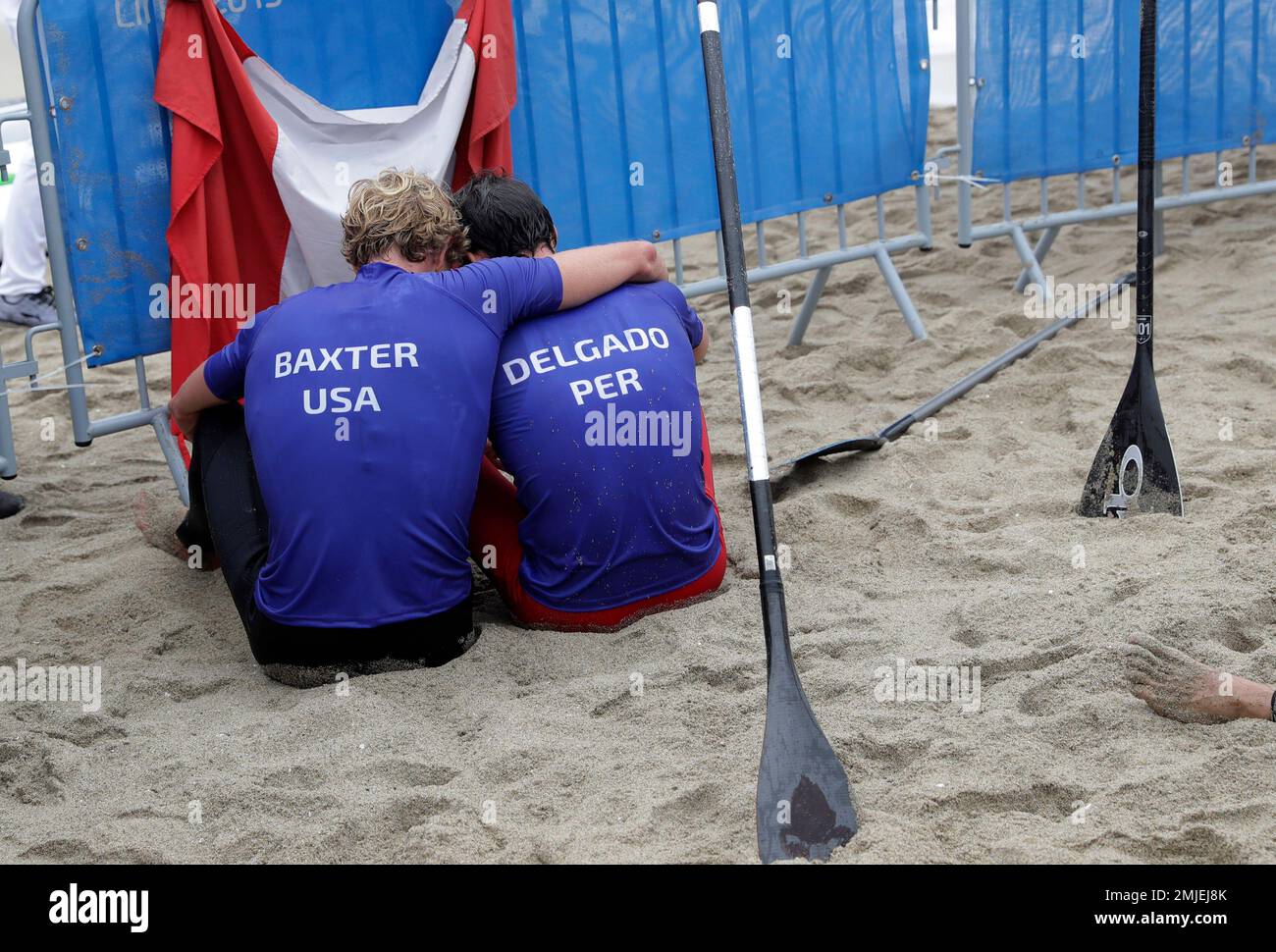 Gold medalist Connor Baxter of the United States, left, embraces Bronze ...