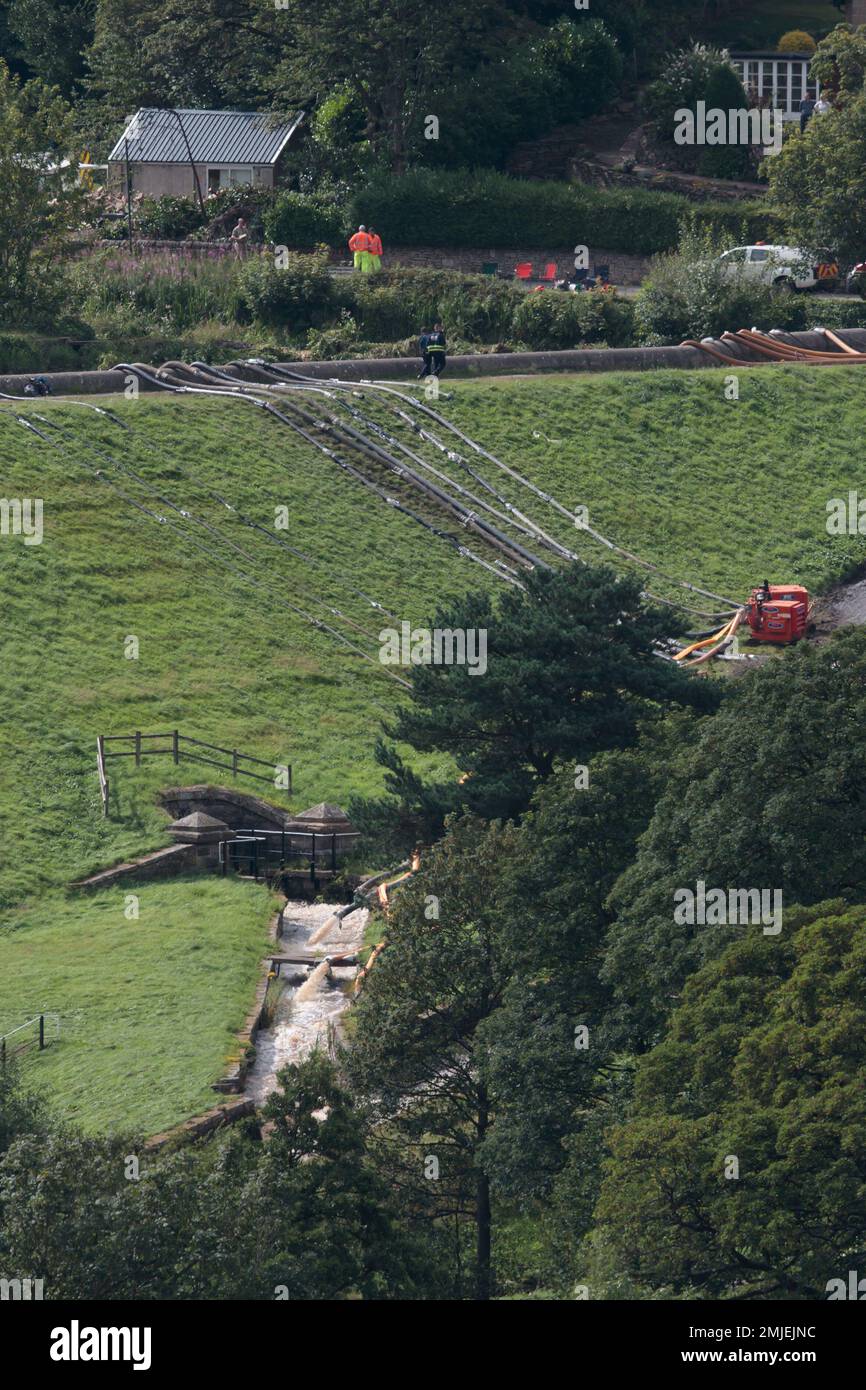 Water is pumped from Toddbrook reservoir which is at risk of collapse ...