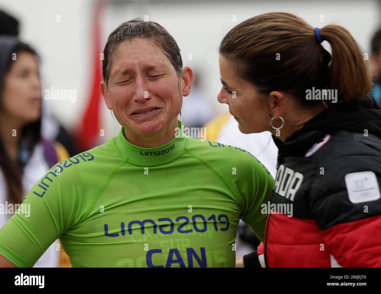 Canada's Lina Augaitis cries after competing in the women's SUP race ...